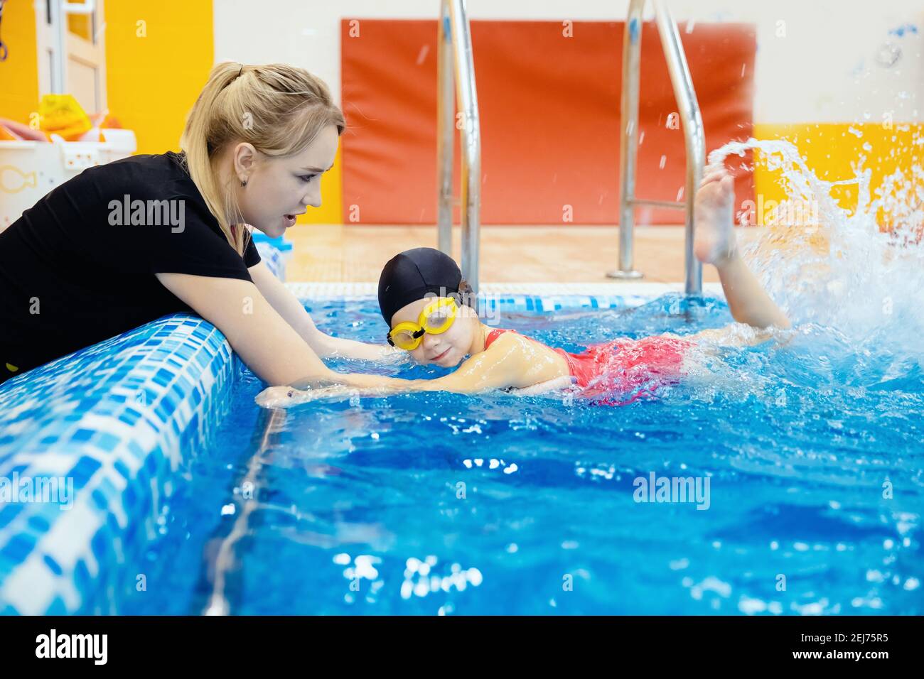 Female coach with swim team hi-res stock photography and images - Alamy