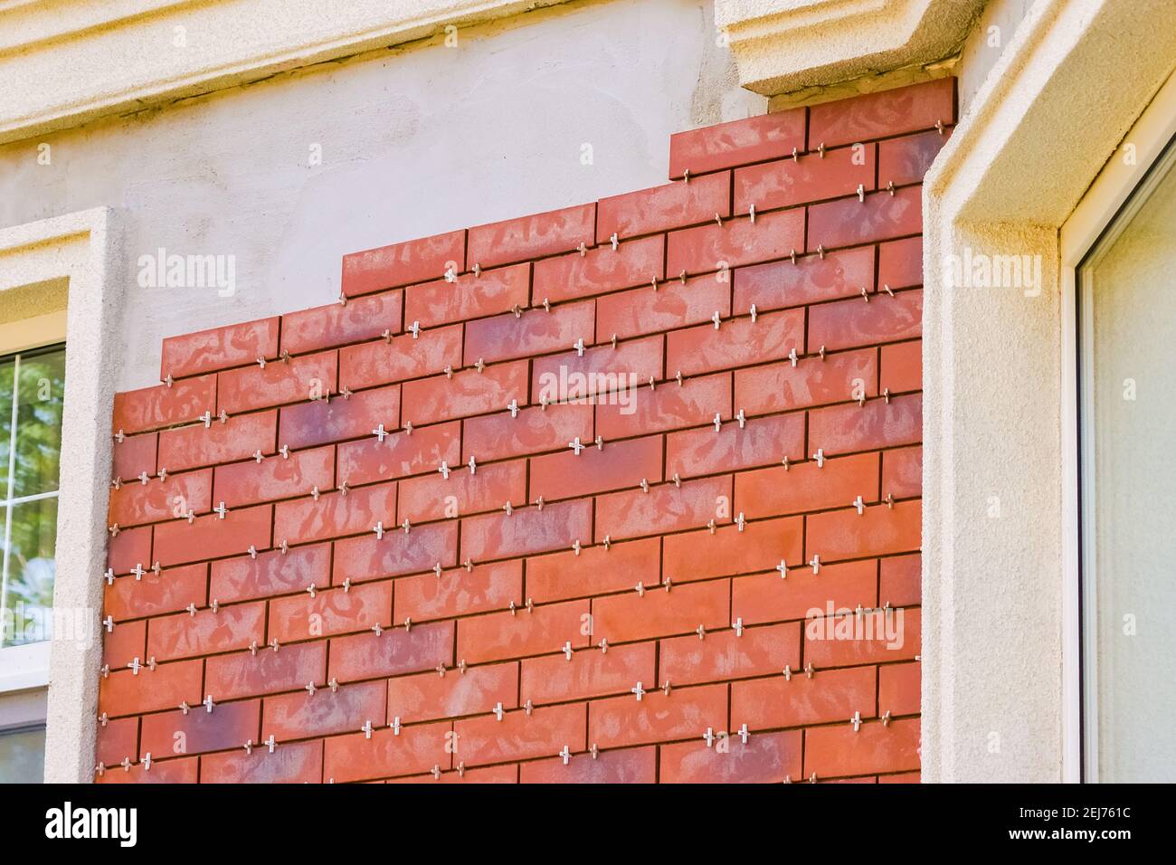 Clinker brick of brown color. Clinker thermal panels for finishing the facade of the house ...
