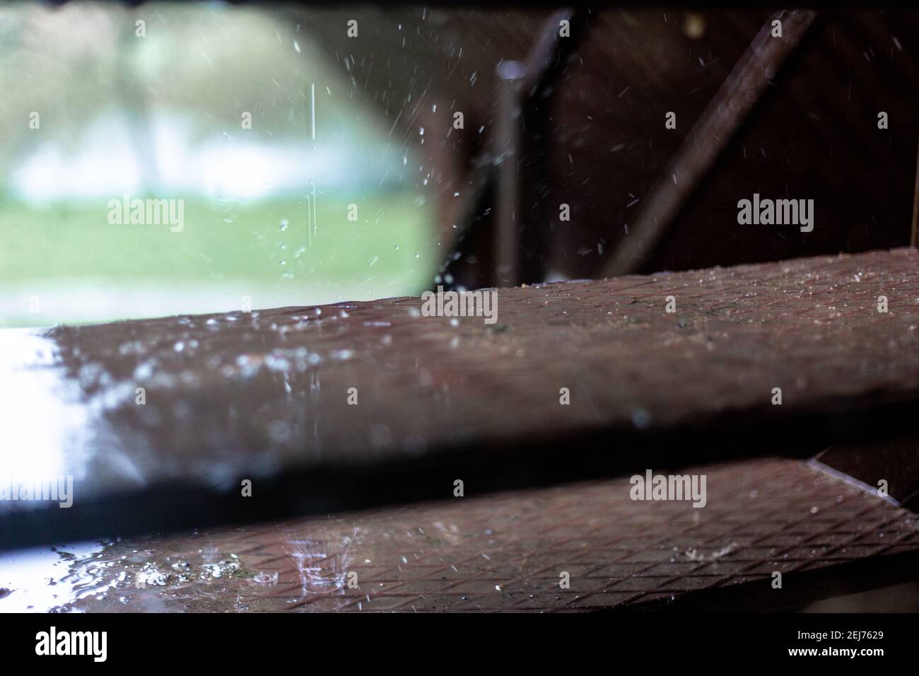 Raindrops dripping on the steps. Brown steps Stock Photo - Alamy