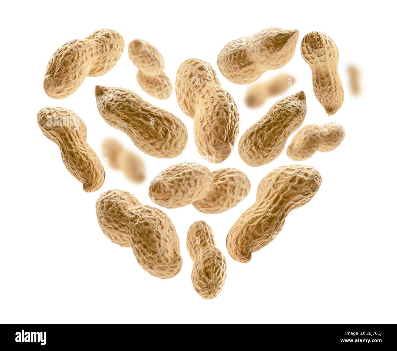 Peanuts in the shell in the shape of a heart on a white background ...