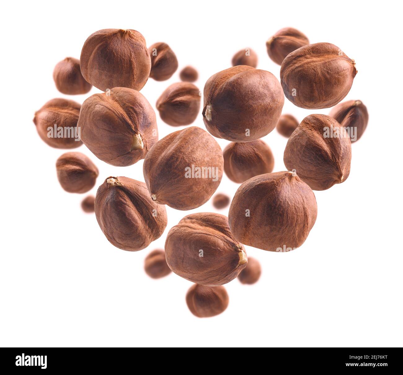 Peeled hazelnut in the shape of a heart on a white background Stock ...