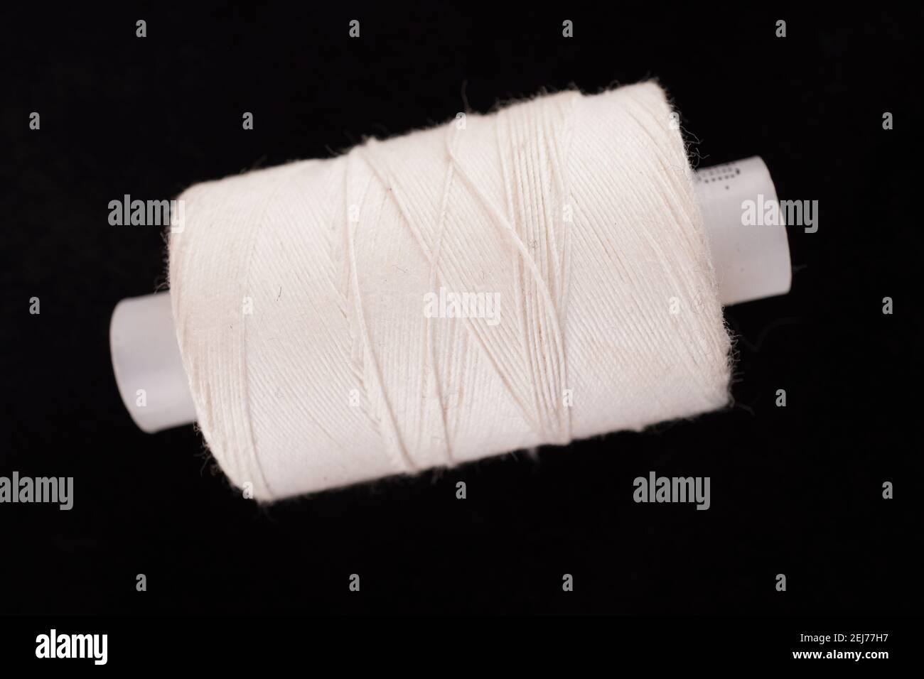 colored threads on a black background Stock Photo - Alamy