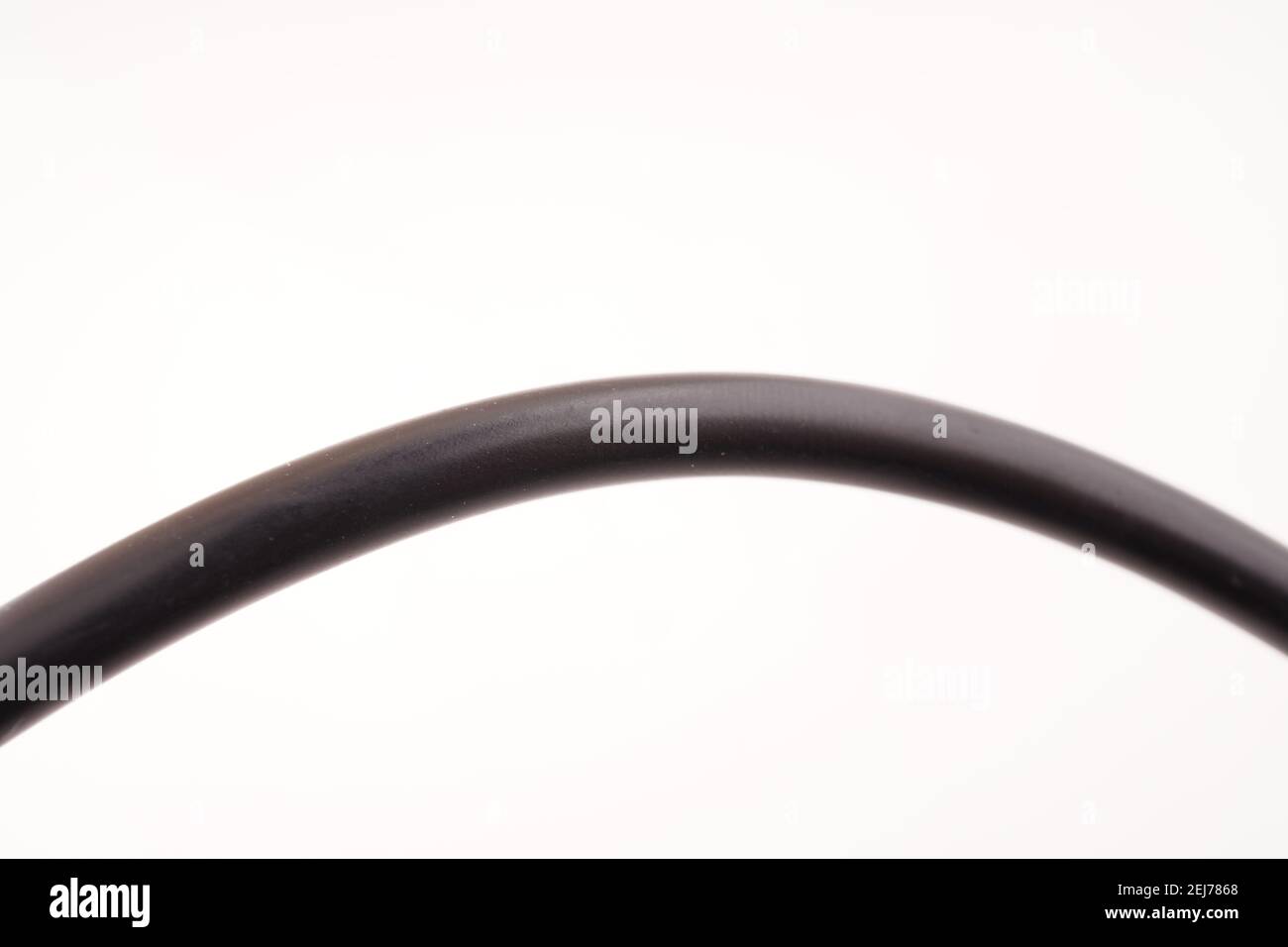 black electrical wire on white background Stock Photo - Alamy