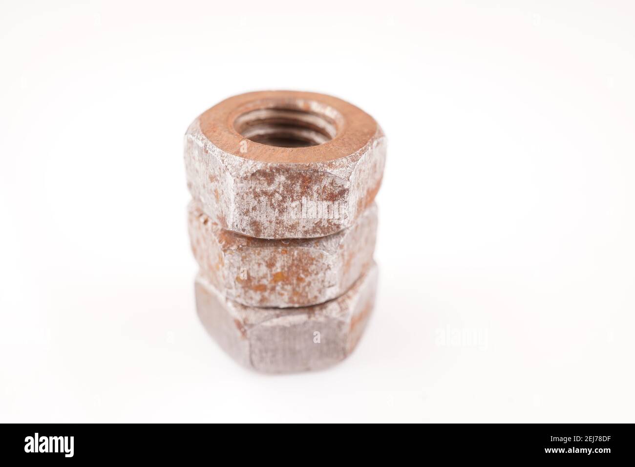 rusty nuts on white background Stock Photo - Alamy