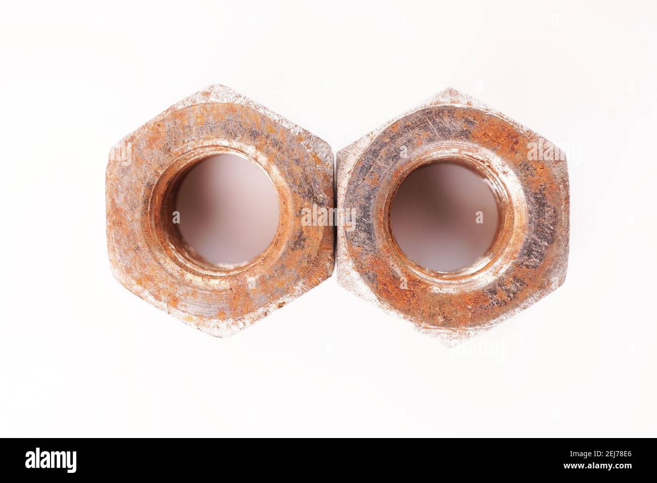 rusty nuts on white background Stock Photo - Alamy