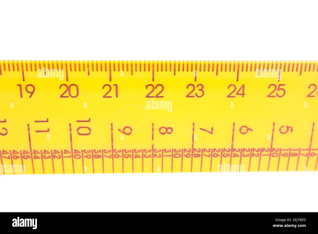 orange ruler on white background Stock Photo - Alamy