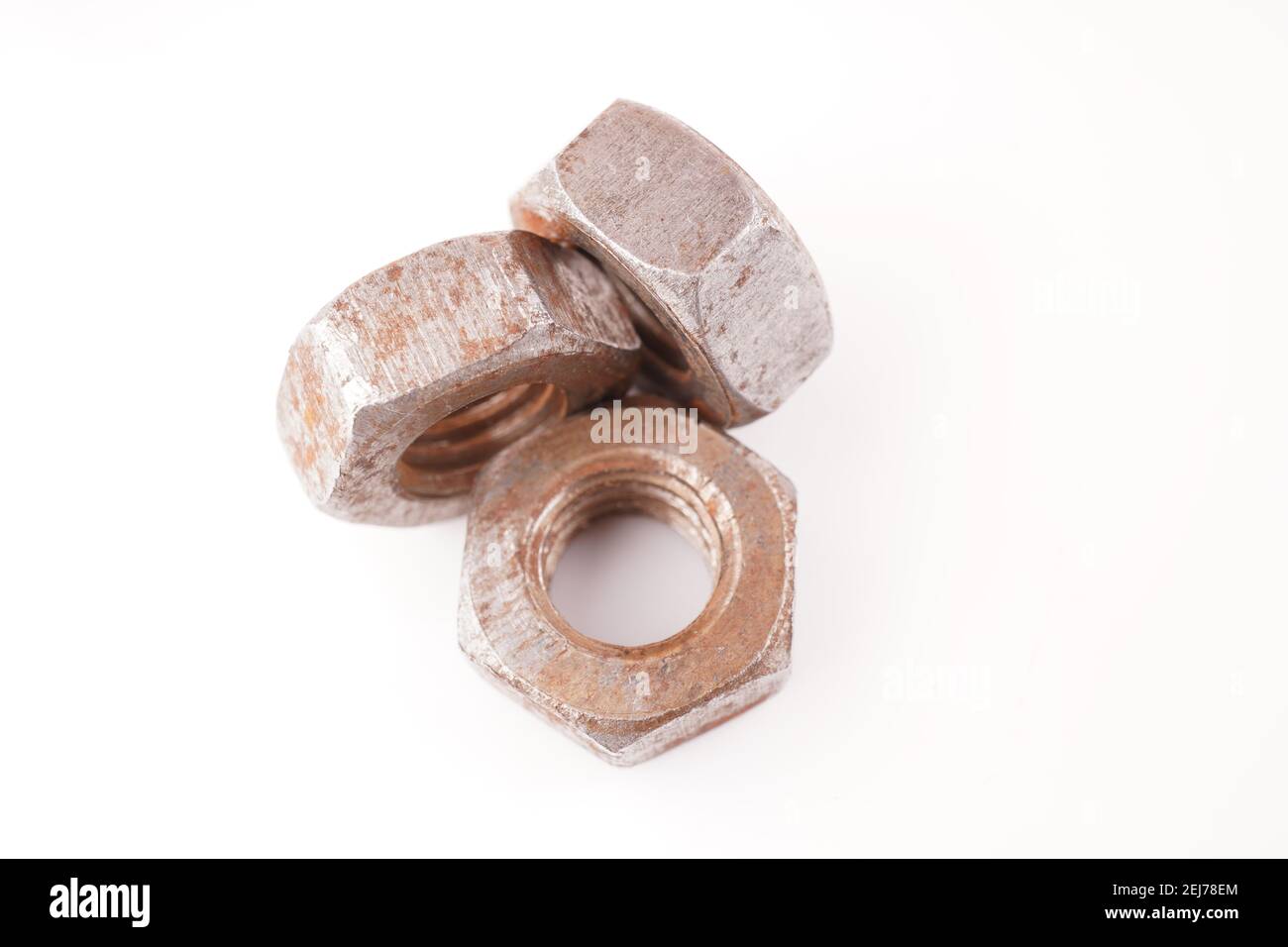 rusty nuts on white background Stock Photo - Alamy