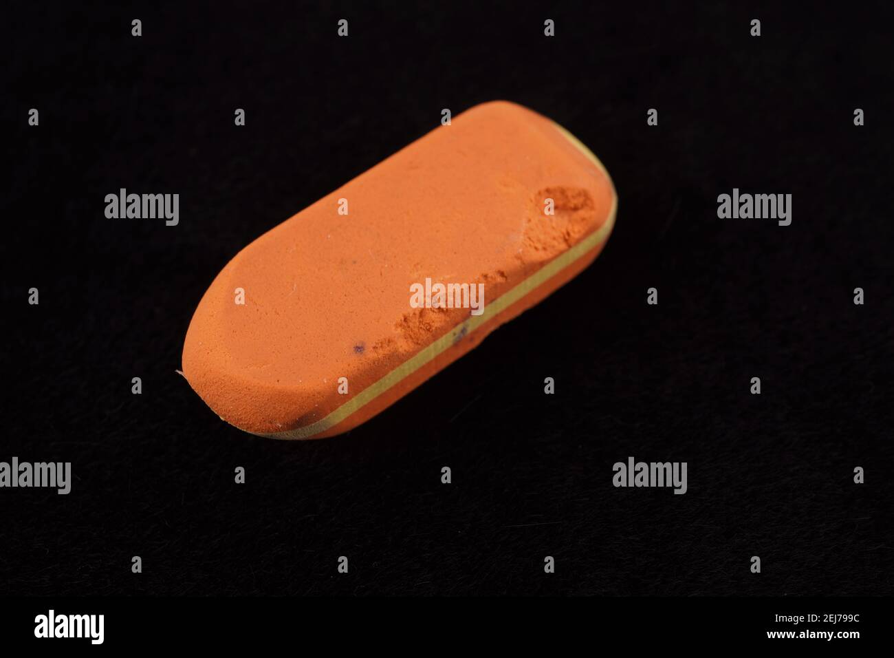 used eraser on black background Stock Photo - Alamy