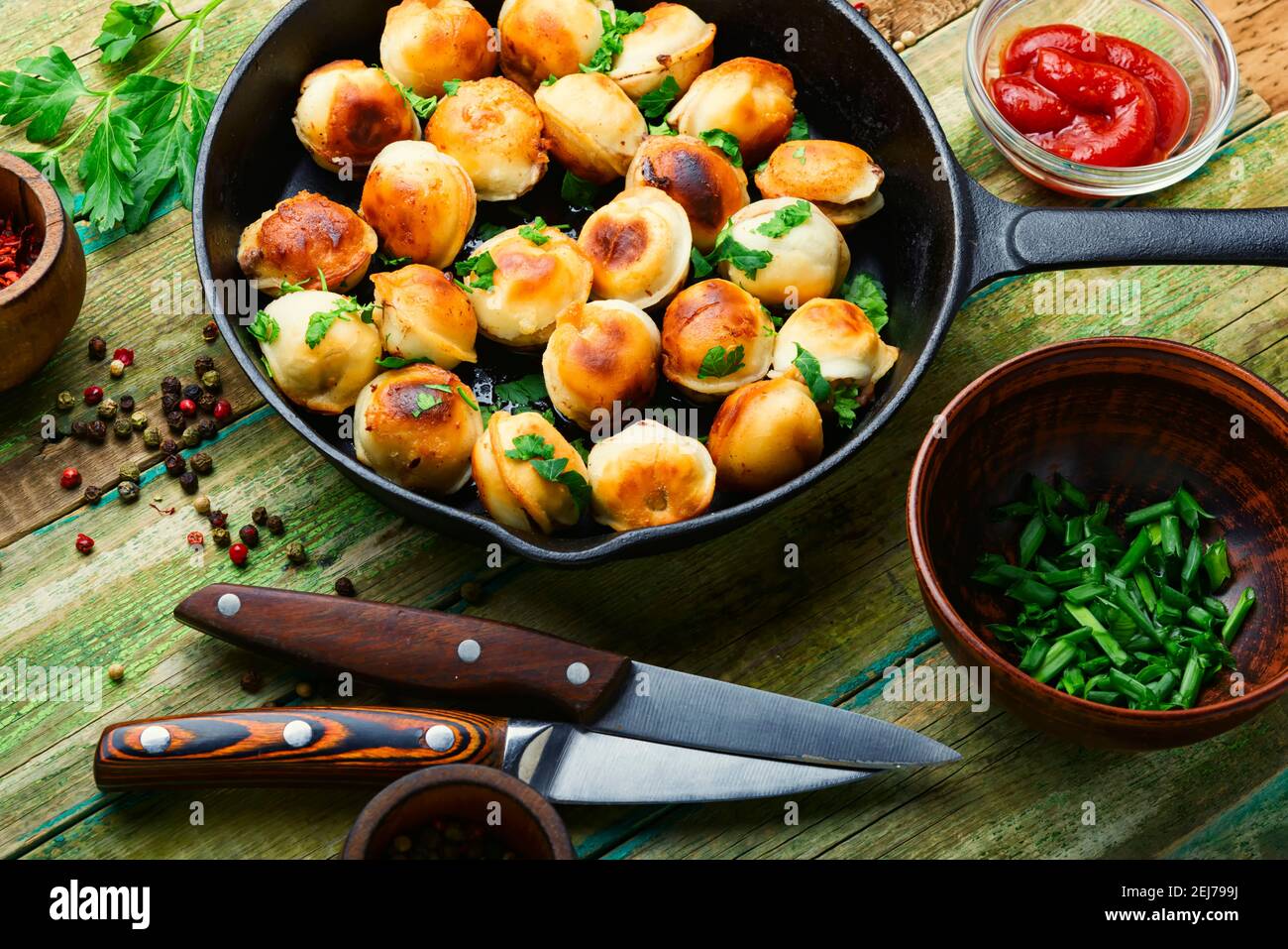 Frying pan with roasted tasty pelmeni.Fried dumplings Stock Photo - Alamy