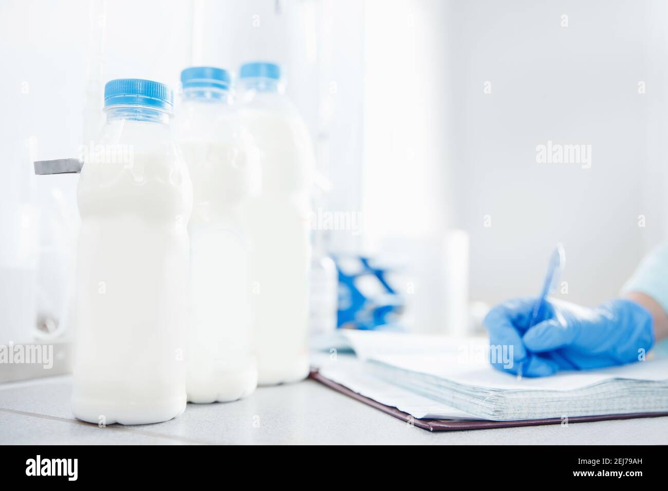 Dairy factory industry products. Quality control test of milk in ...