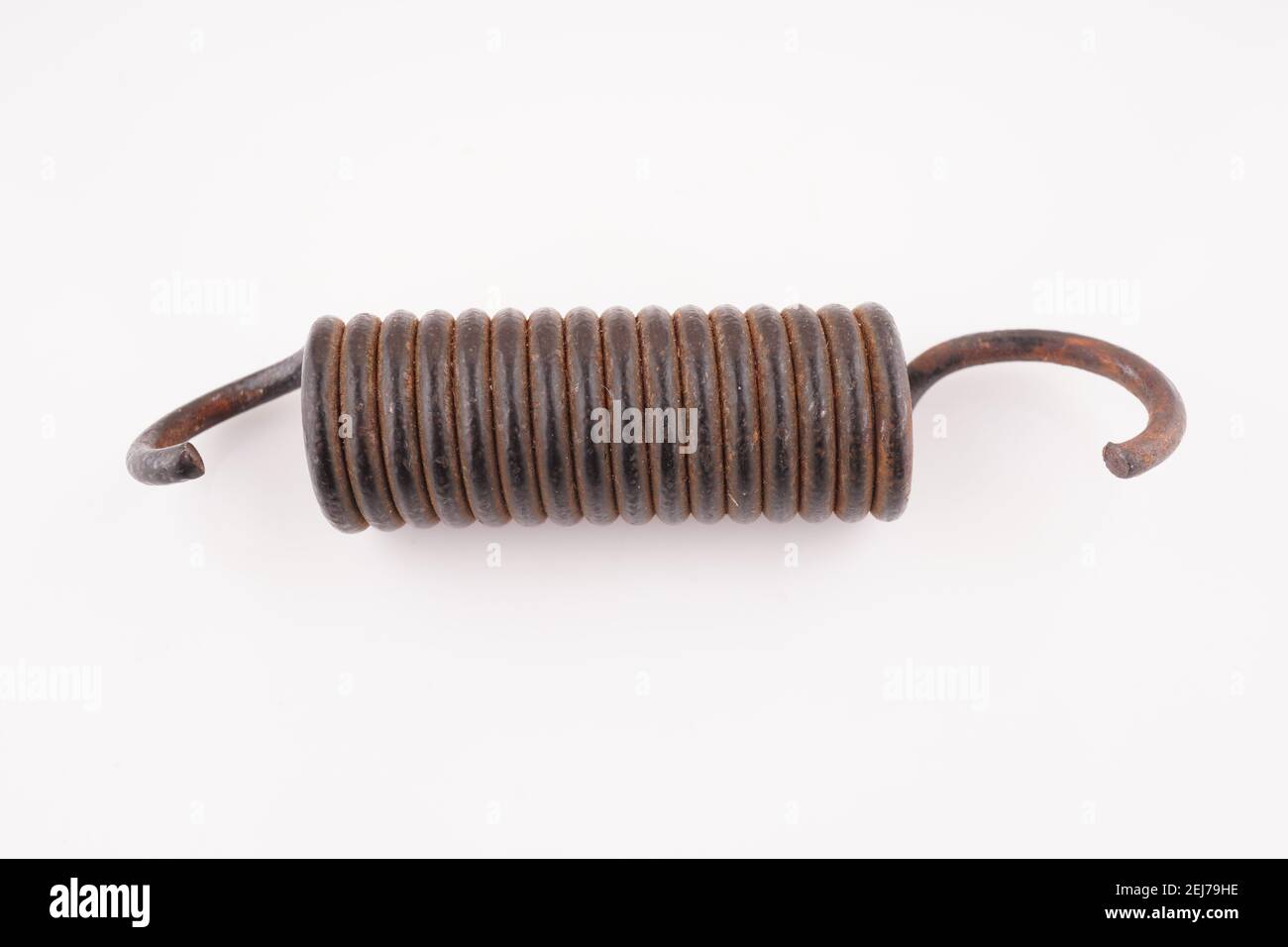 rusty spring on white background Stock Photo - Alamy