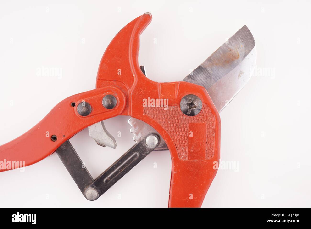 red knife for plastic pipes on a white background Stock Photo - Alamy
