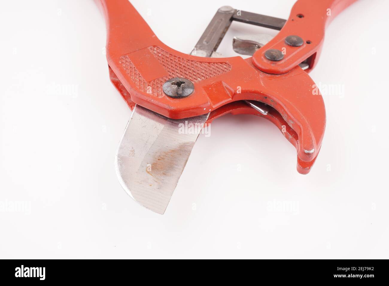red knife for plastic pipes on a white background Stock Photo - Alamy