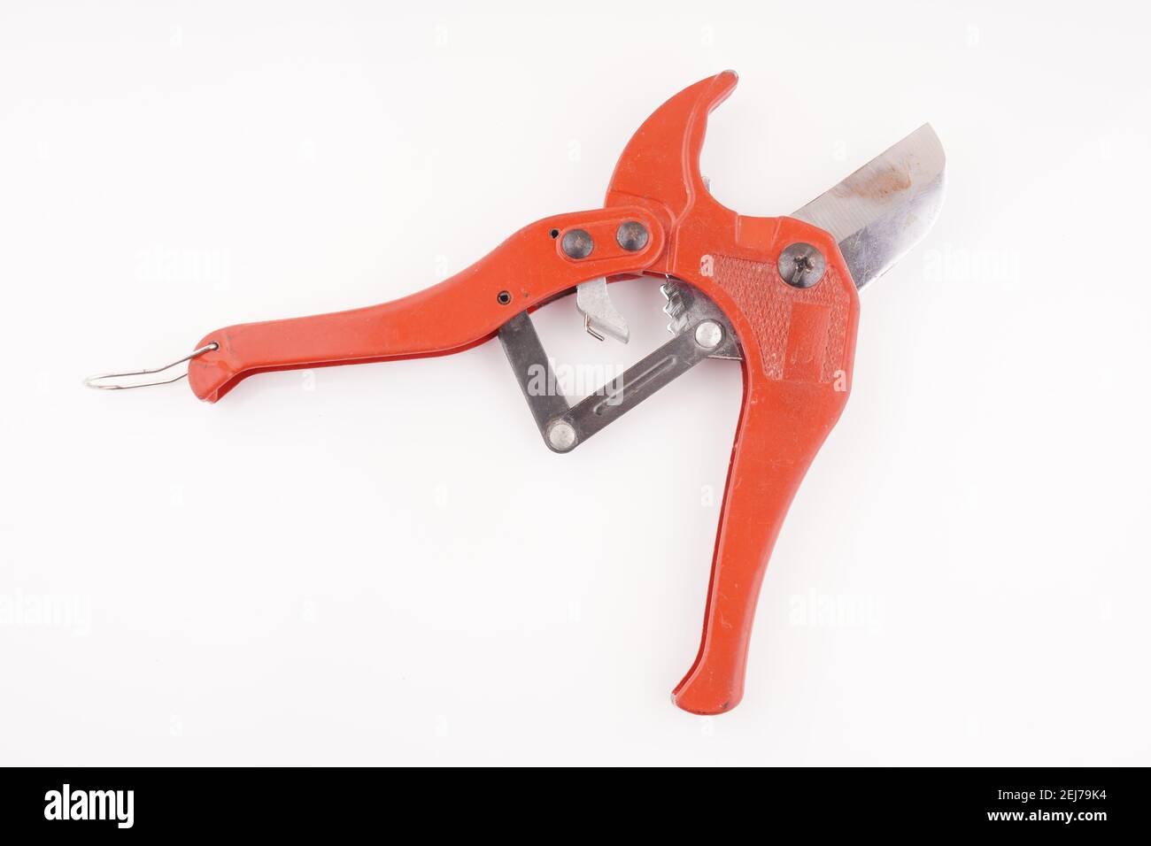 red knife for plastic pipes on a white background Stock Photo - Alamy