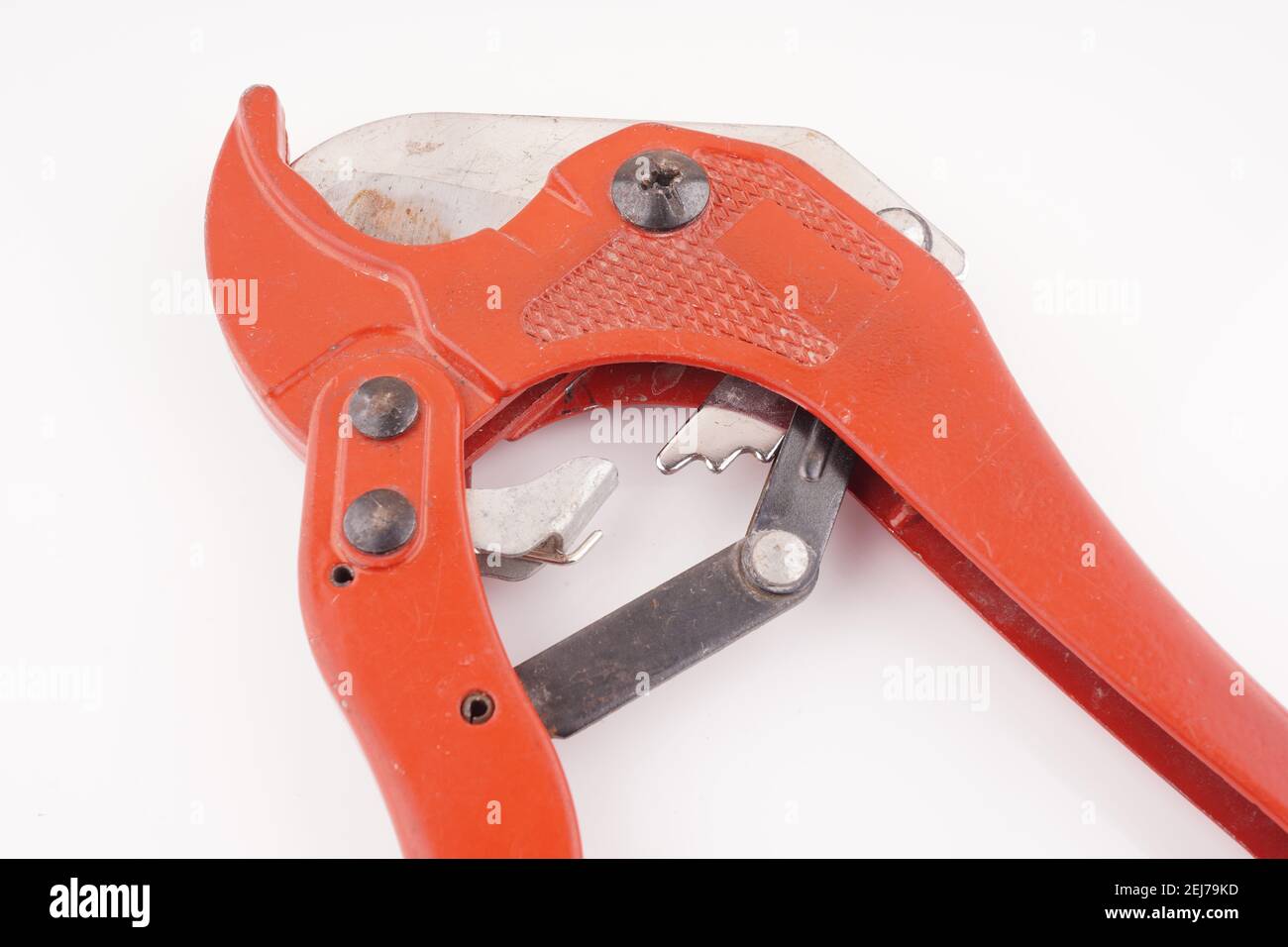 red knife for plastic pipes on a white background Stock Photo - Alamy