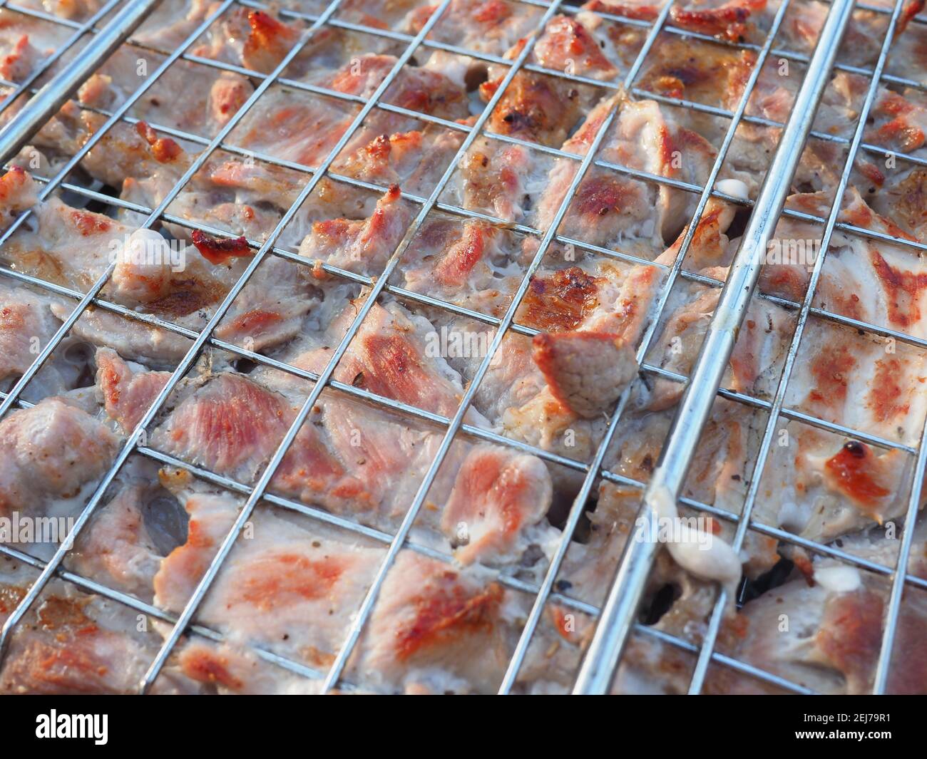 kebab on a metal grid is cooked over the fire Stock Photo - Alamy