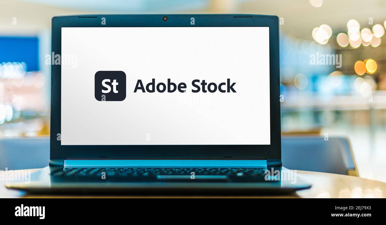 POZNAN, POL - AUG 8, 2020: Laptop computer displaying logo of Adobe ...