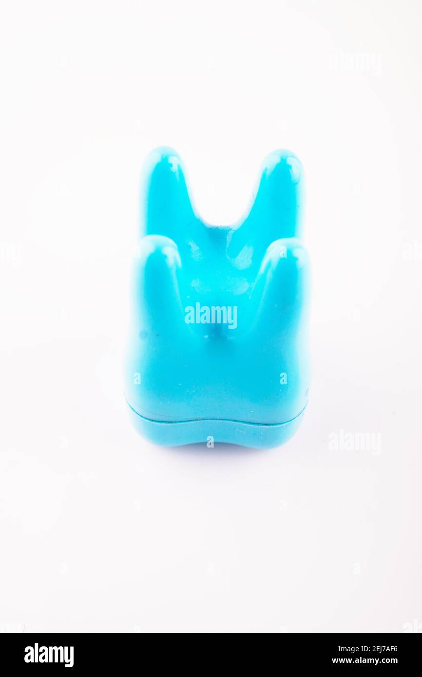 plastic toy tooth on white background Stock Photo - Alamy