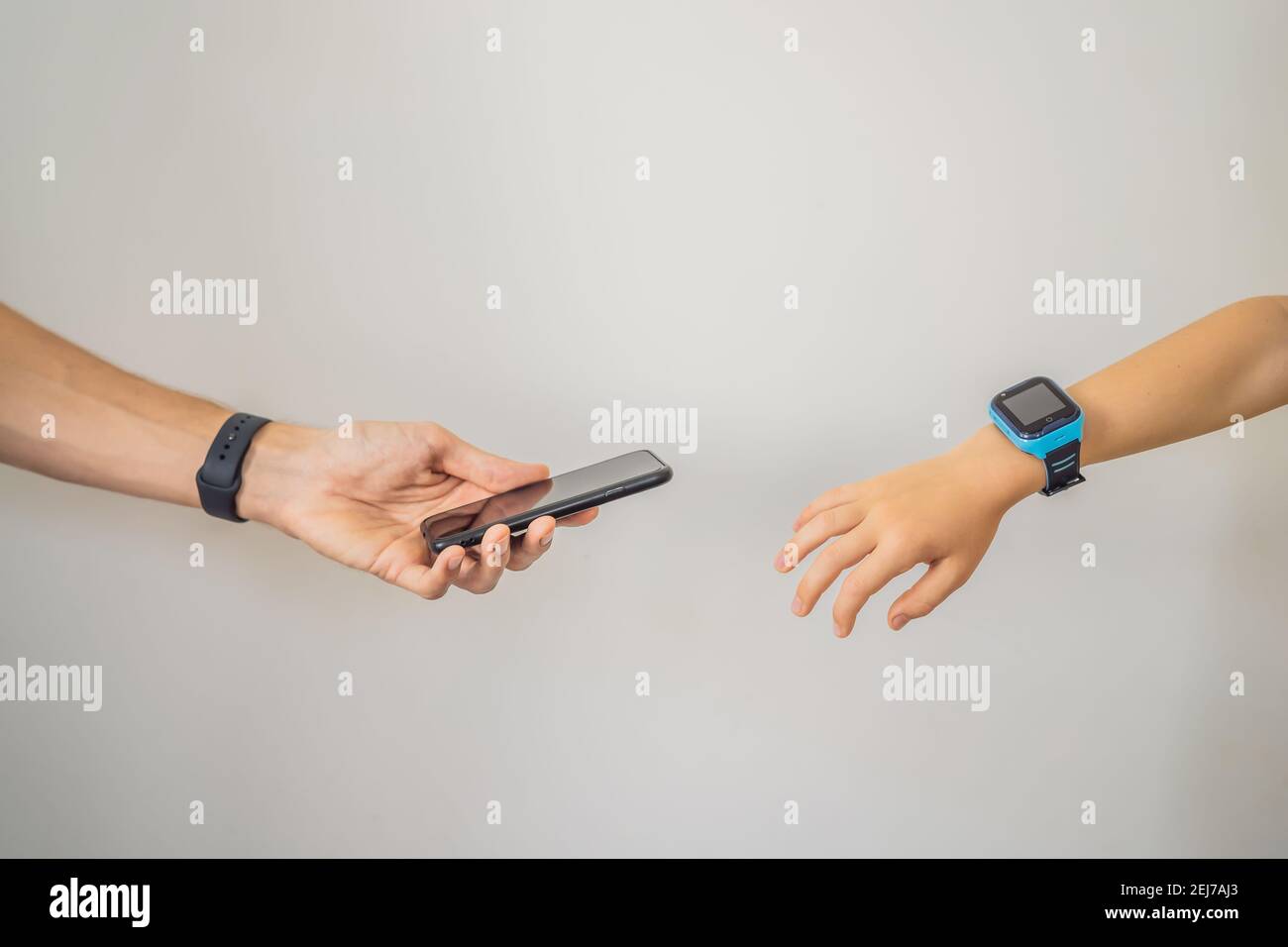 Dad's hand reaches for the hand of the child in the smart children's ...