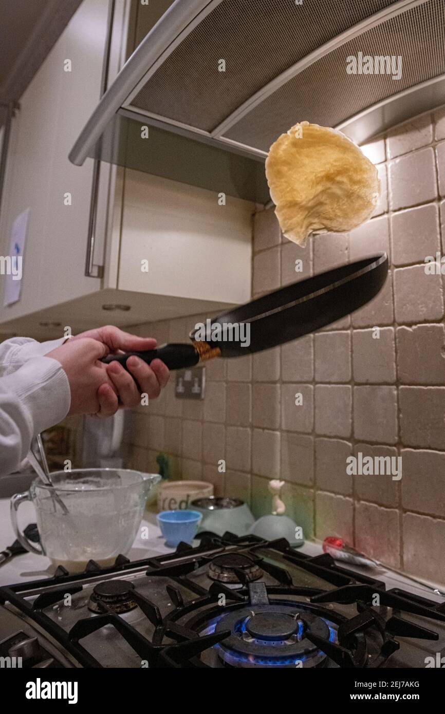 Boy flipping pancake hi-res stock photography and images - Alamy
