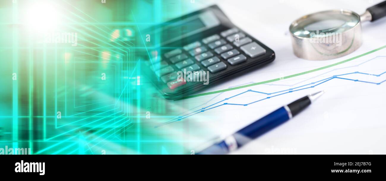 Magnifying glass, calculator, pen on a financial graph; multiple ...
