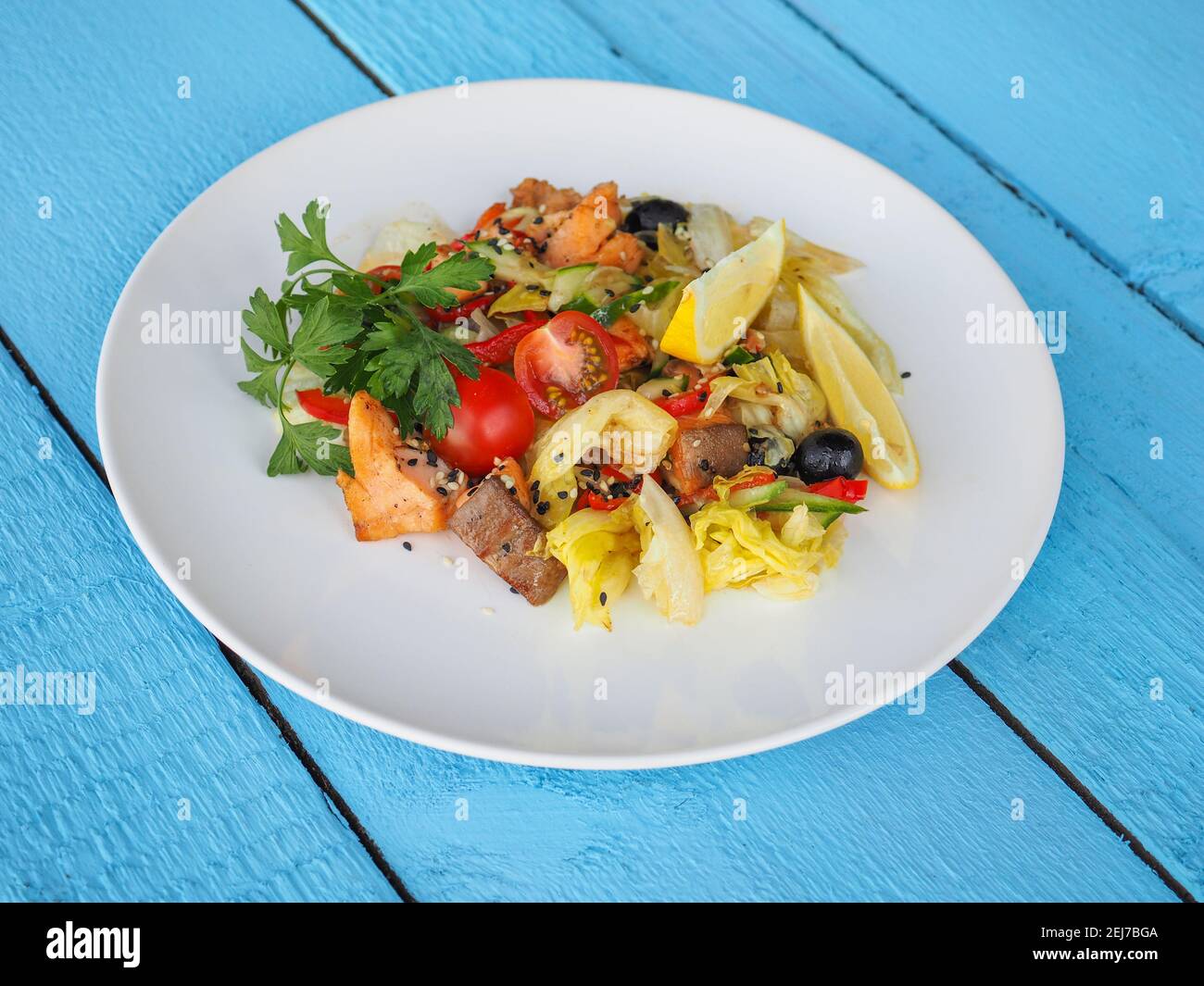 Chicken salad on blue wooden background Stock Photo - Alamy