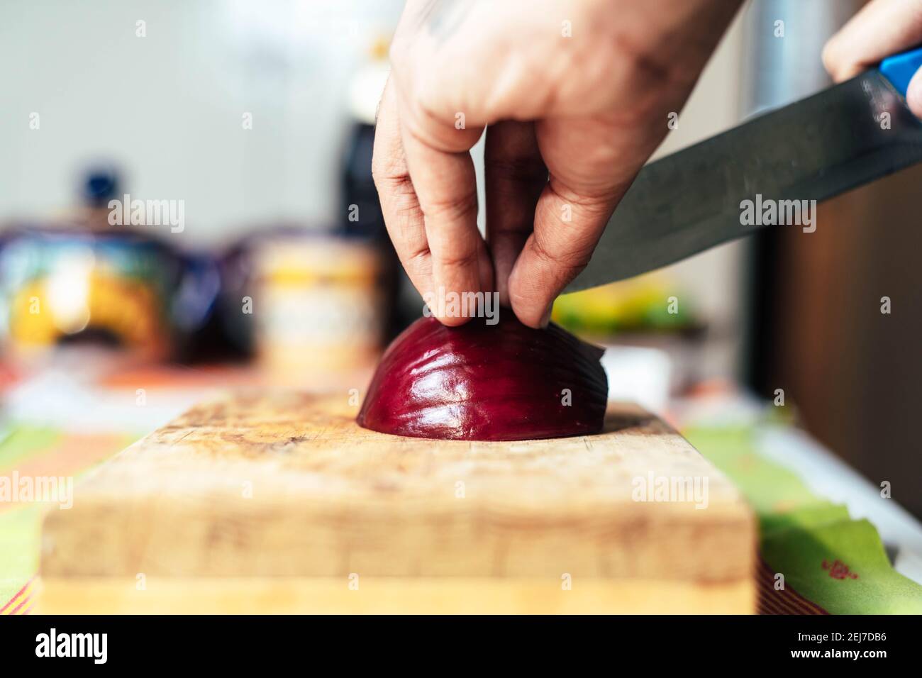 Splitting purple onion for typical Mexican apricot Stock Photo - Alamy