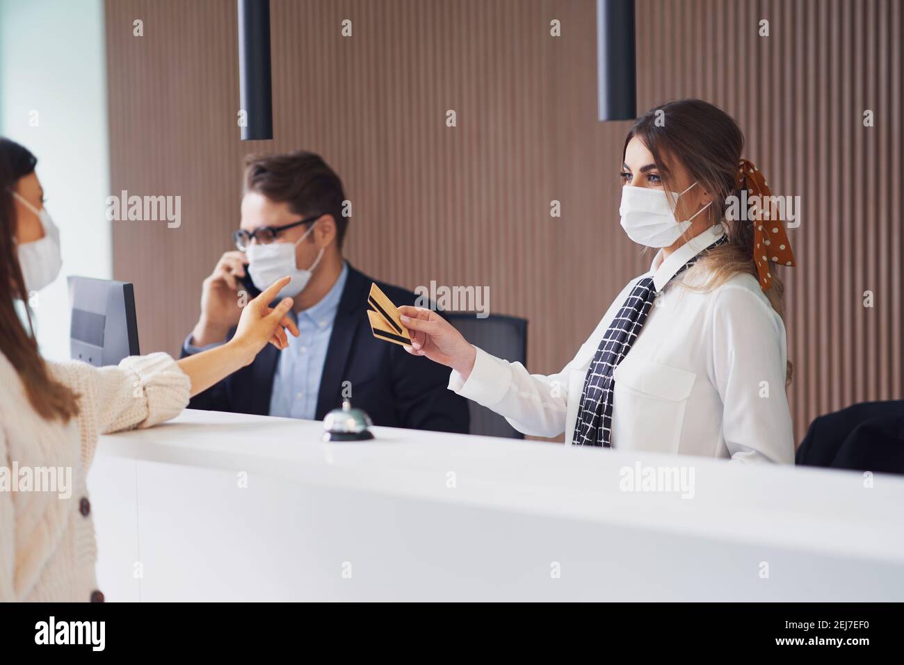 Receptionist working in a hotel Stock Photo - Alamy