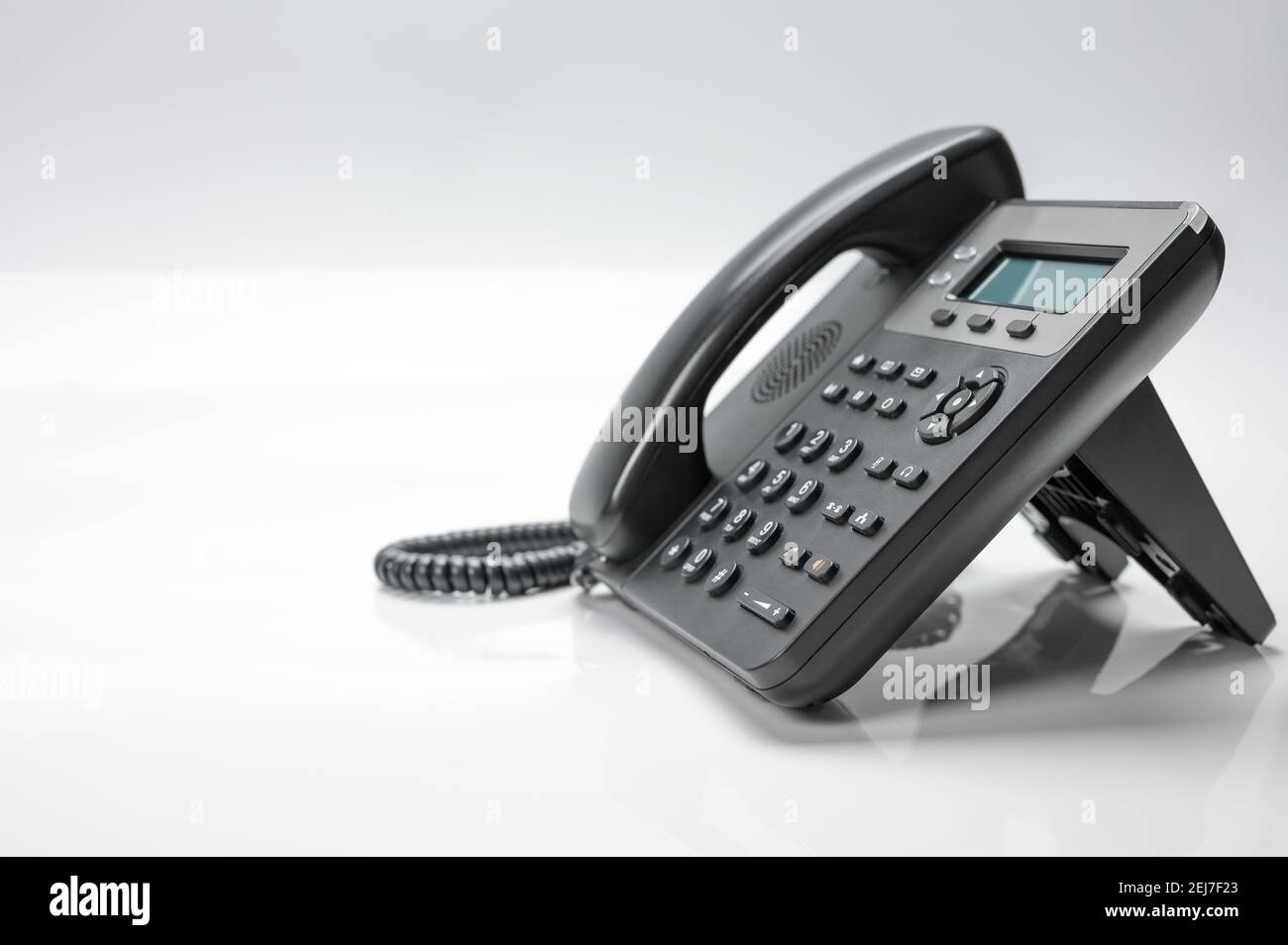 black Telephone set with display and buttons. Modern phone for ip ...