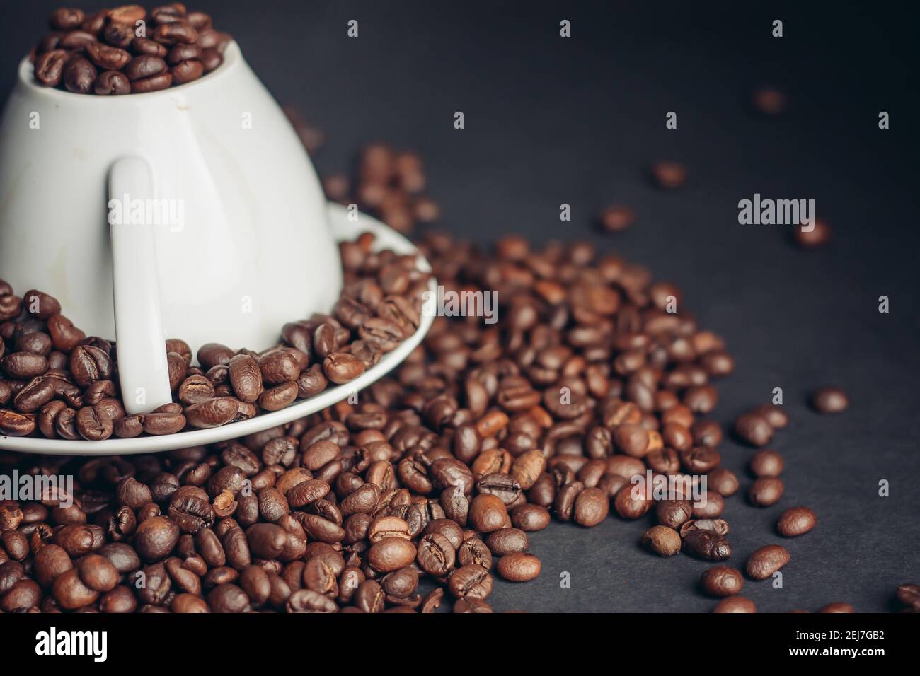coffee grain on inverted mug and saucer on gray Arabica table Stock ...