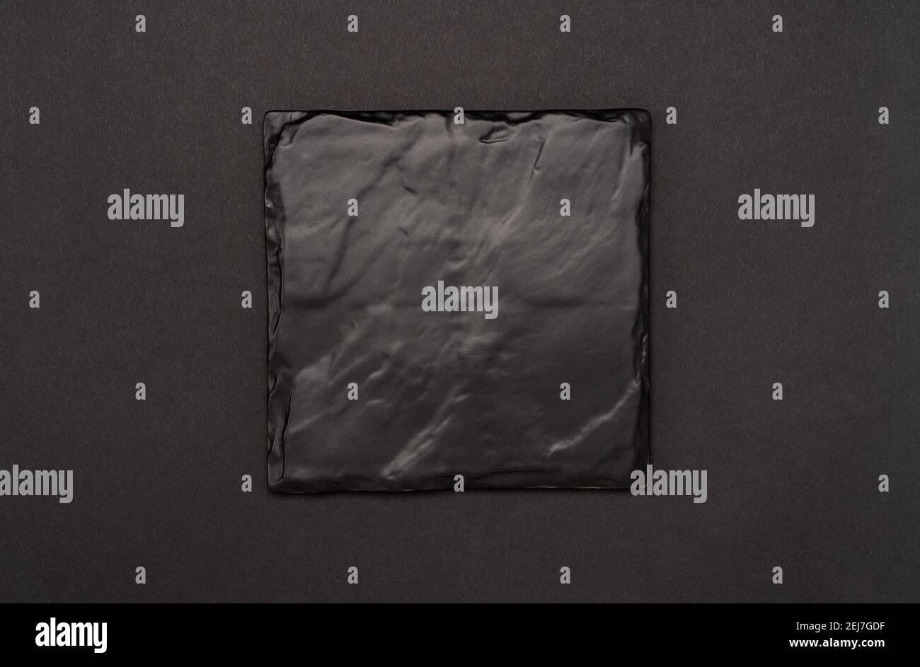 square black slate board or plaque for menu or recipe text on black ...