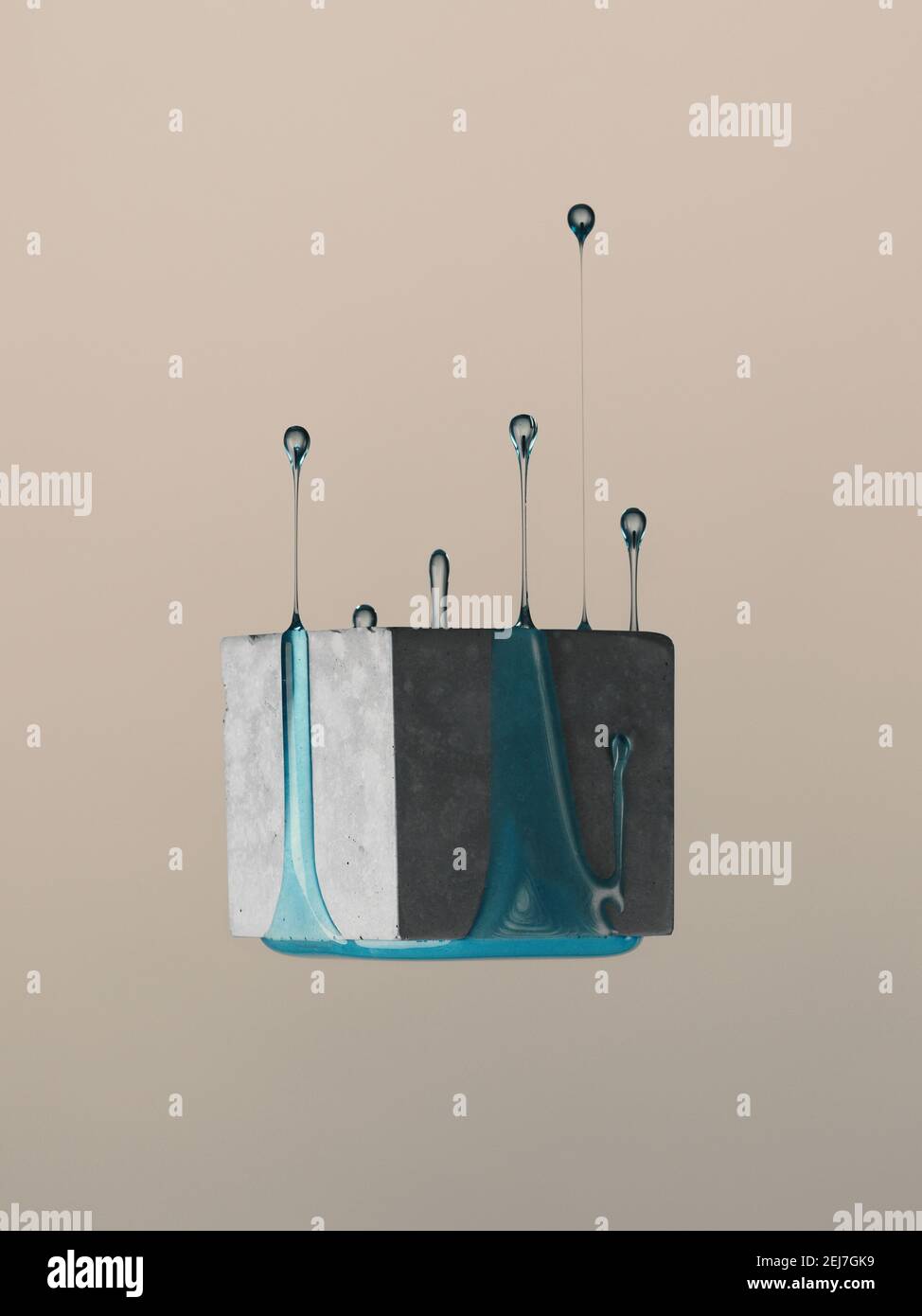 Upside-down of a gray cube with blue paint dripping upward isolated on ...