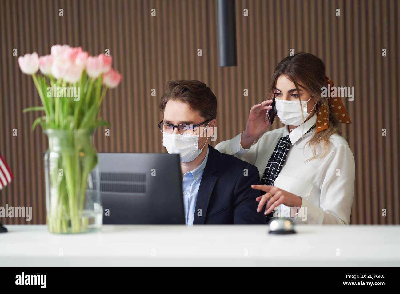 Receptionist working in a hotel Stock Photo - Alamy