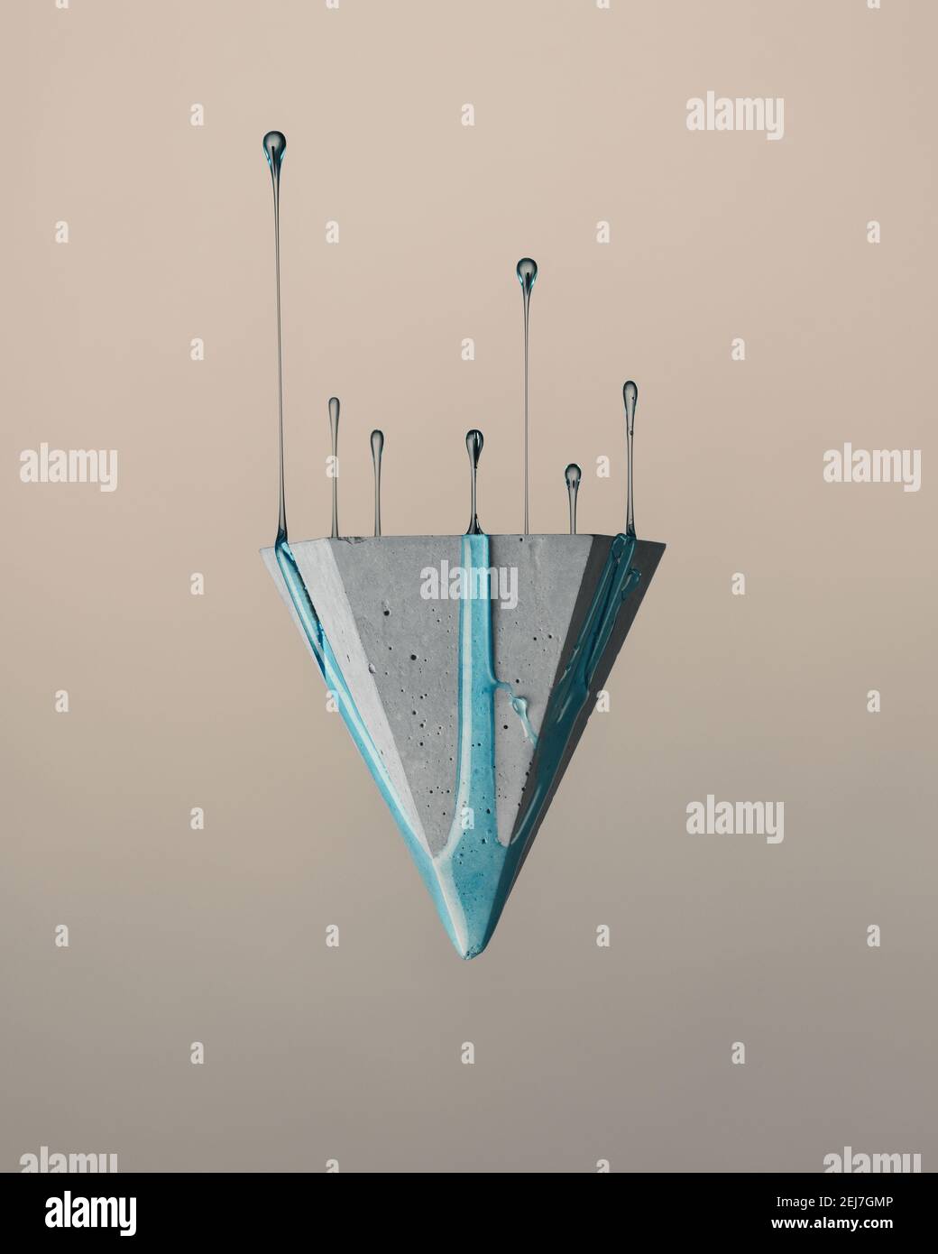 Upside-down of a gray triangle with blue paint dripping upward isolated ...