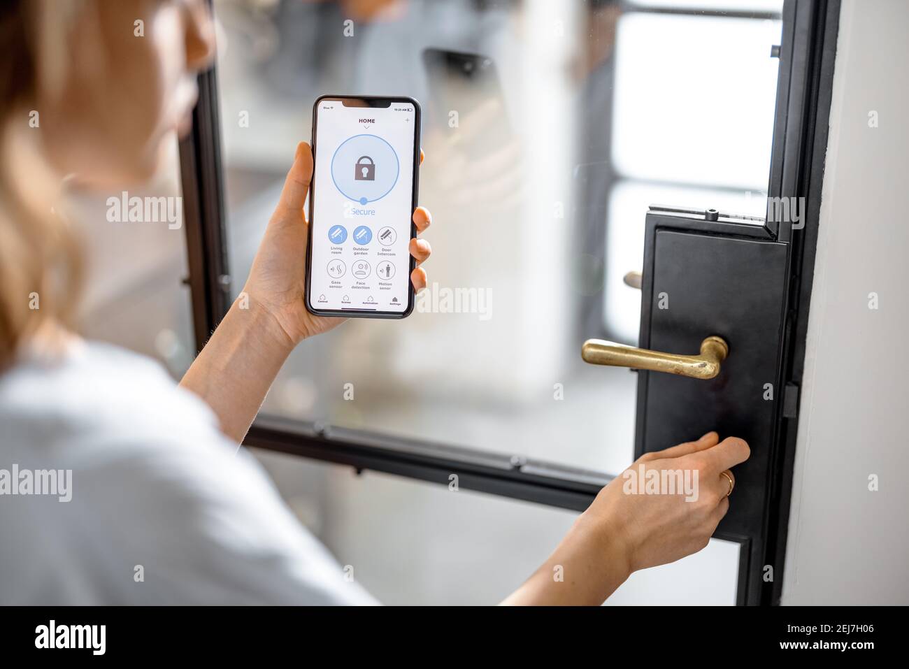 Smartphone with launched application for alarm security Stock Photo - Alamy
