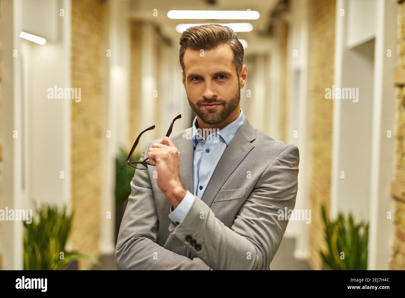 Calm clever man standing hi-res stock photography and images - Alamy