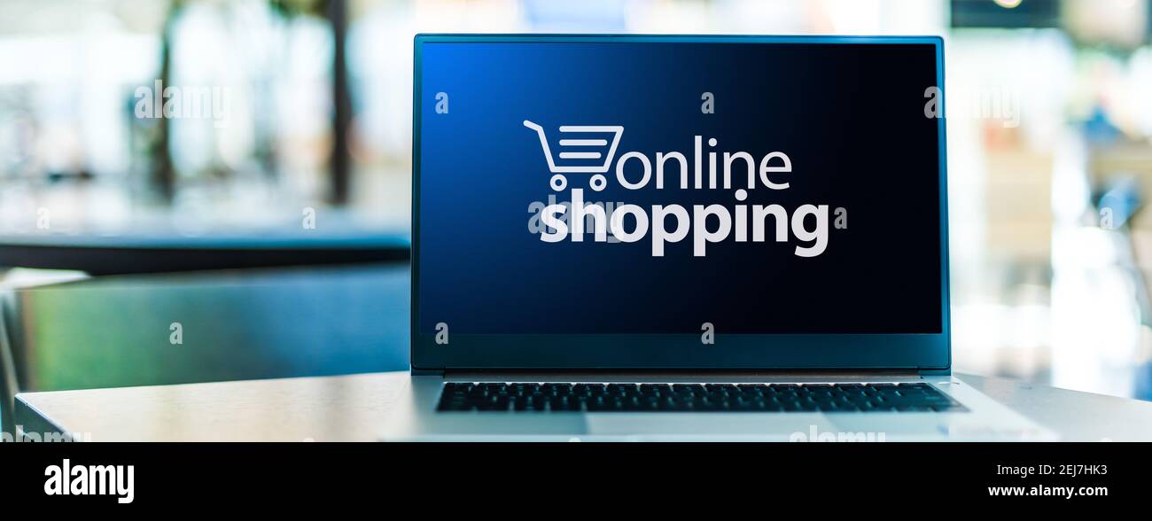 Laptop computer displaying online shopping logo. E-commerce Stock Photo ...