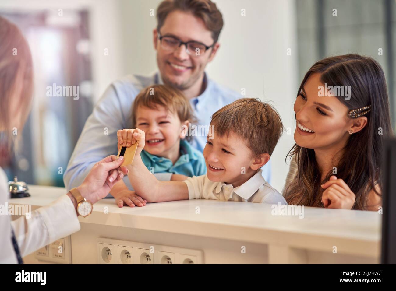 Family daughter reception desk in hi-res stock photography and images ...