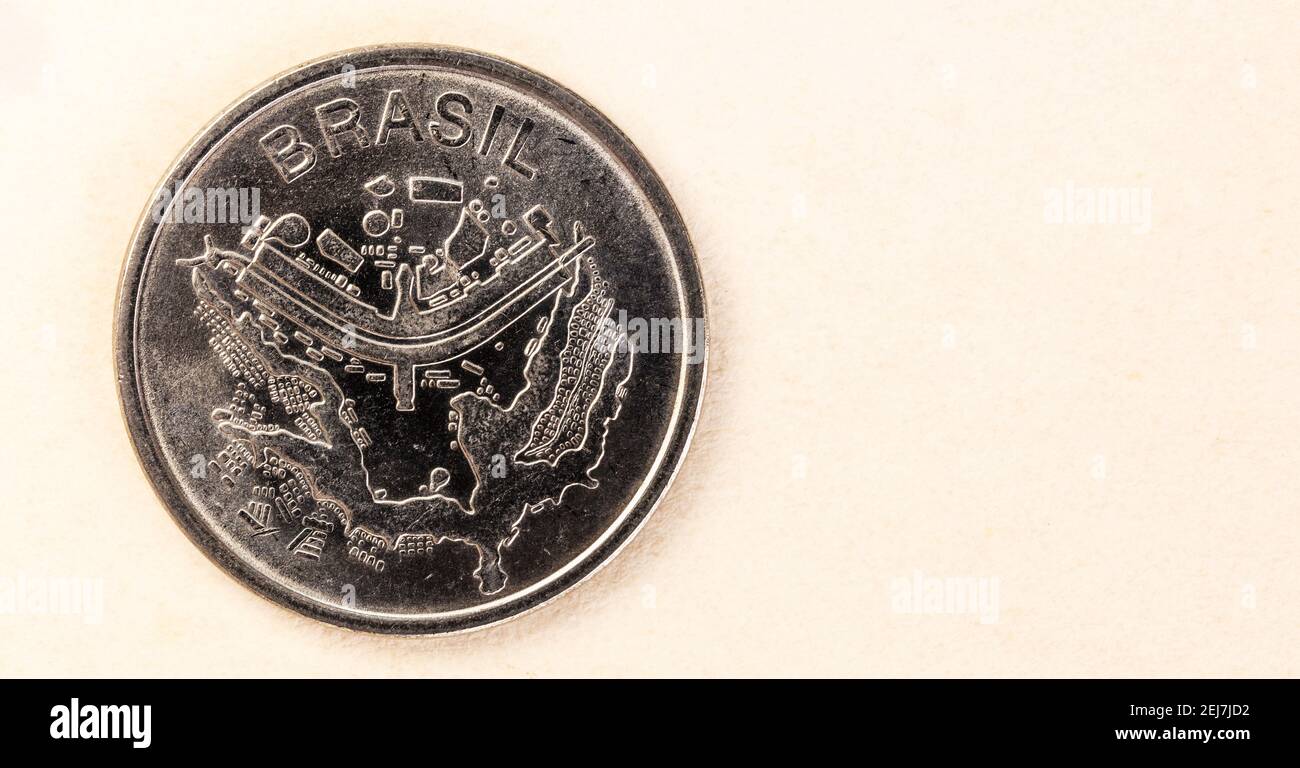 Old Brazilian real coin on a beige backgrou Stock Photo - Alamy