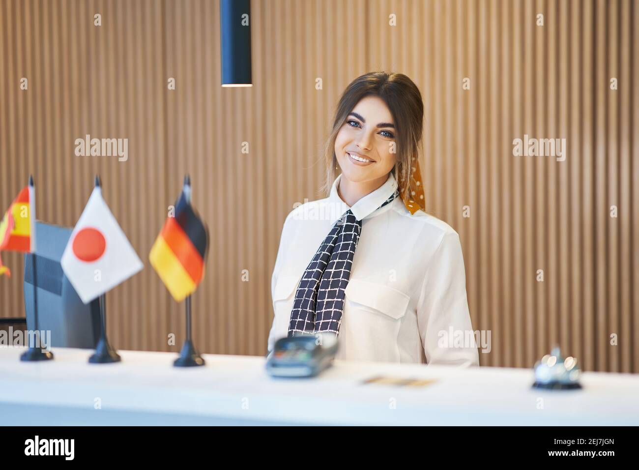 Receptionist working in a hotel Stock Photo - Alamy