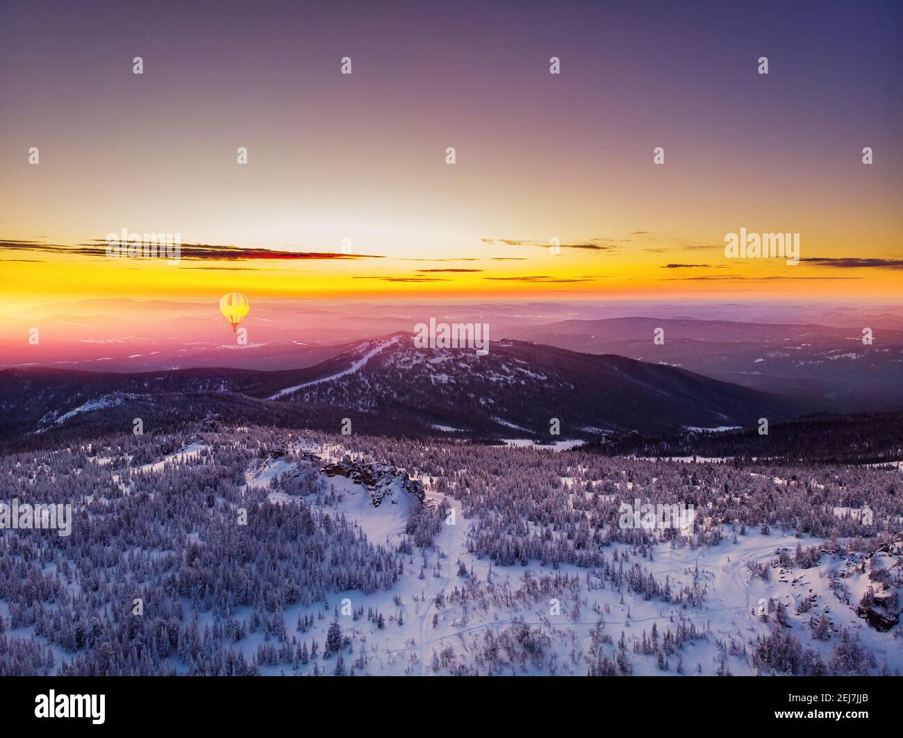 Colorful winter sunset in Sheregesh ski resort mountains with clouds ...