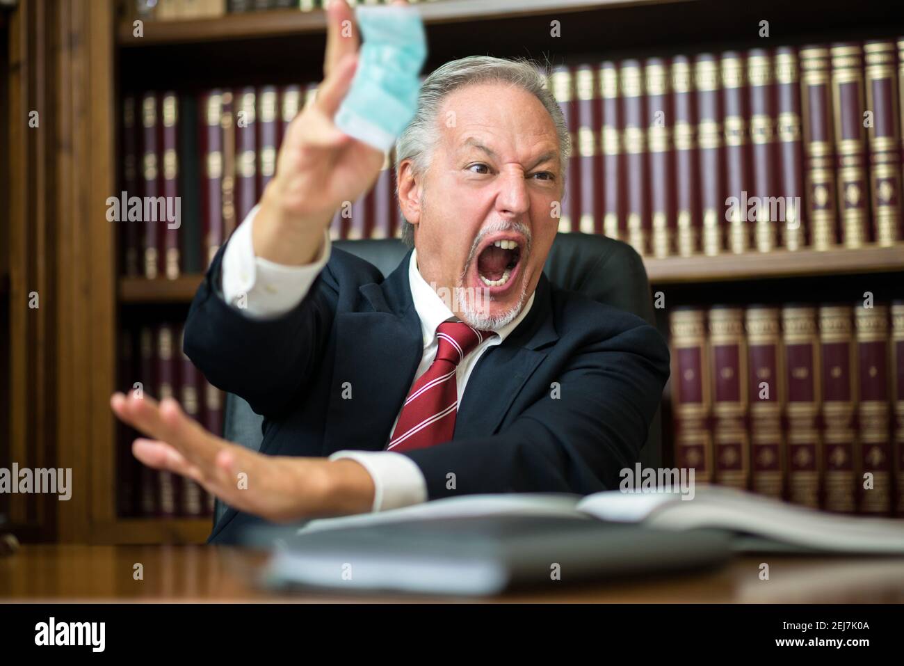 Angry business man thowing away a surgical mask Stock Photo - Alamy