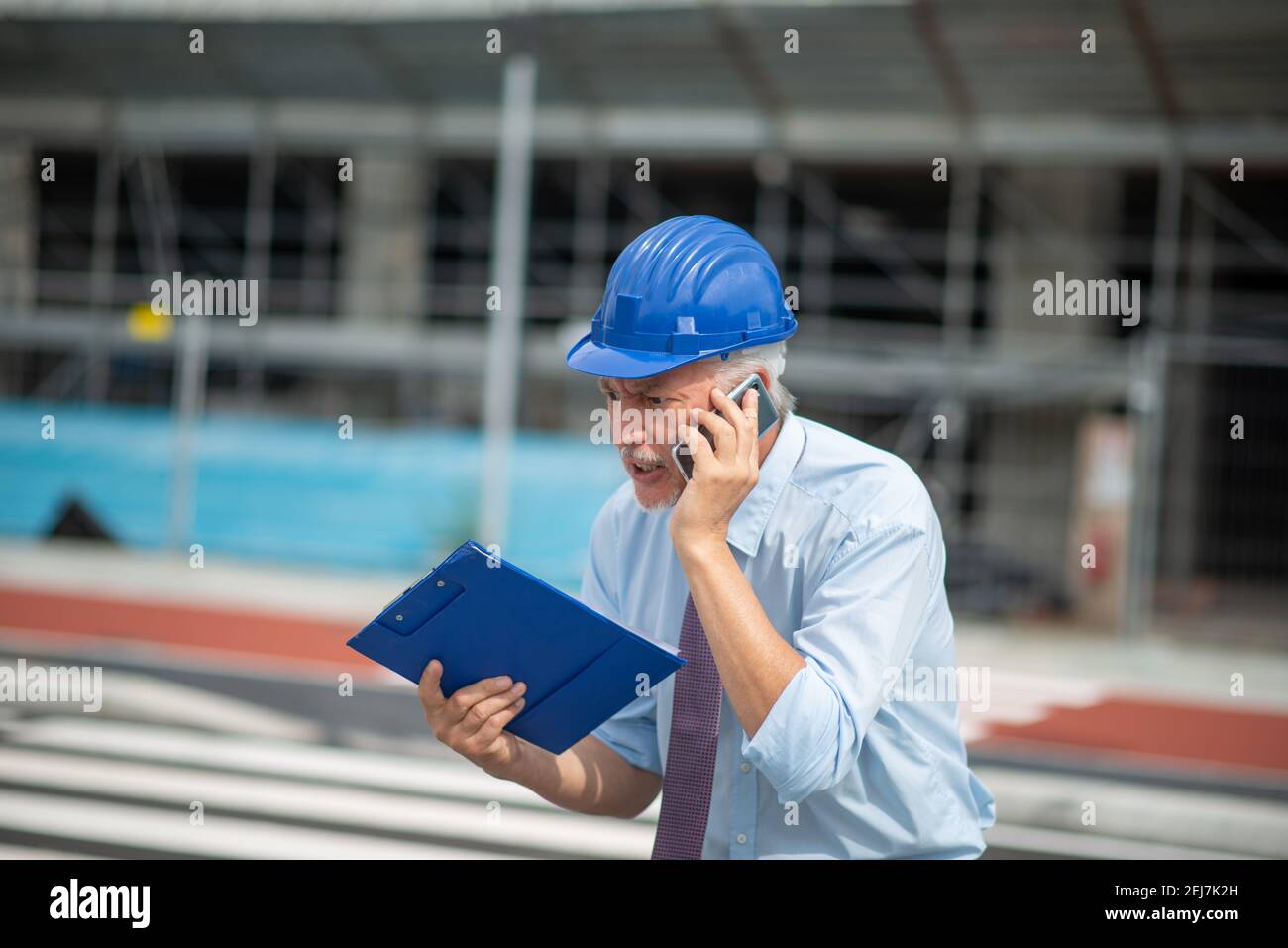 Angry construction foreman talking on hi-res stock photography and ...