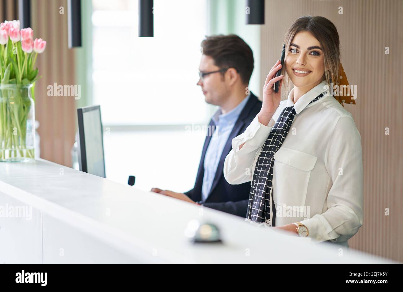 Male clerk at a reception counter hi-res stock photography and images ...