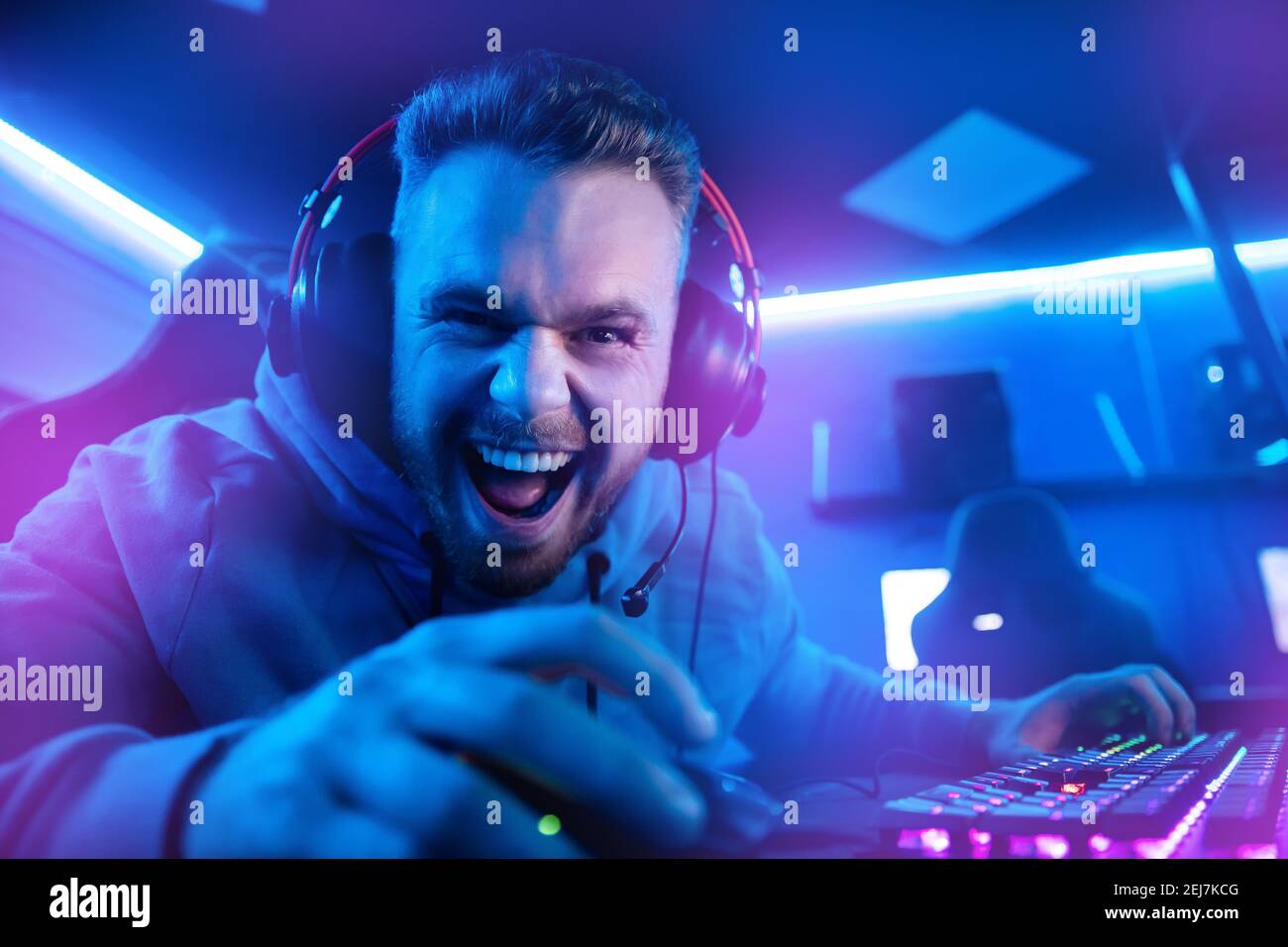 Streamer young man rejoices in victory professional gamer playing ...