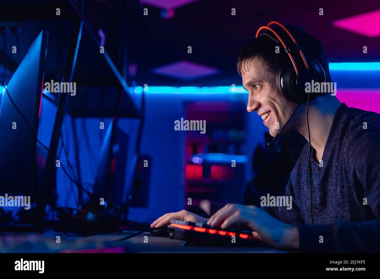 Streamer young man rejoices in victory professional gamer playing ...