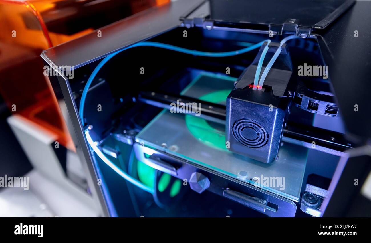 Modern 3D printer printing figure home close-up macro in innovation ...