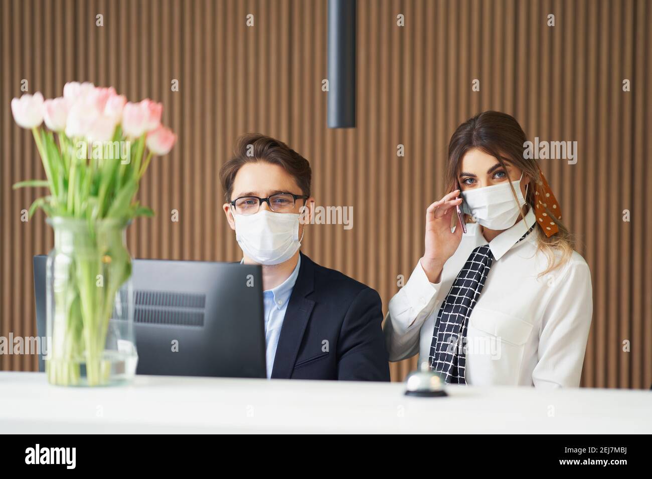 Receptionist working in a hotel Stock Photo - Alamy