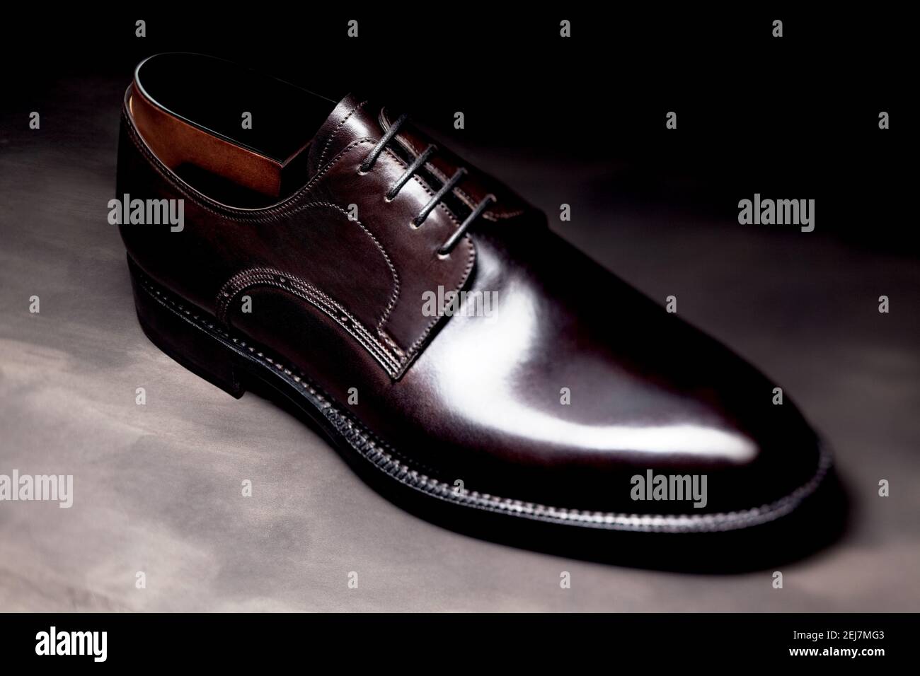 Hand-built leather men's shoe close-up detailed studio shot Stock Photo ...
