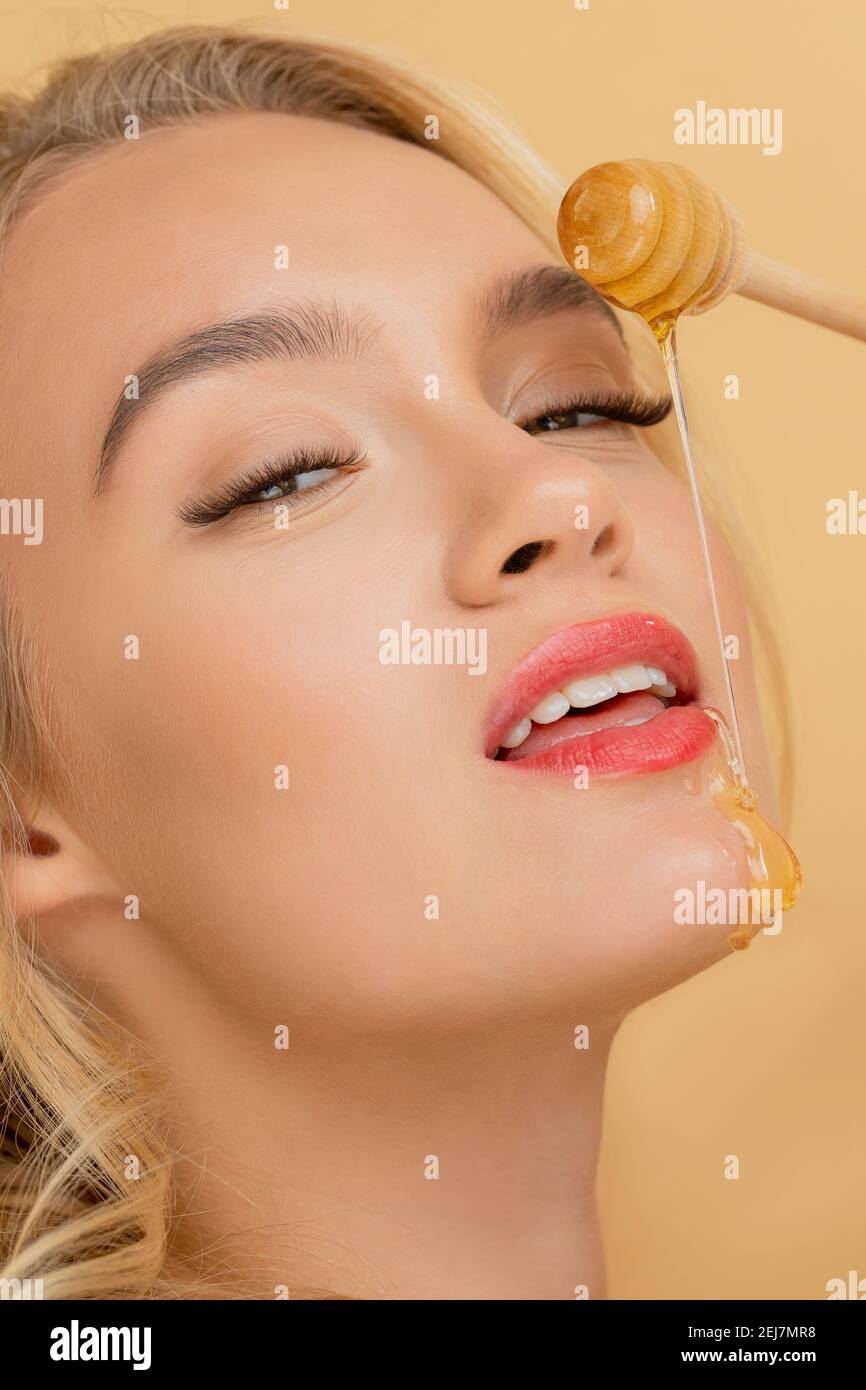 Fashion Photo Woman Extended Fake Eyelashes With Honey On Face Stock